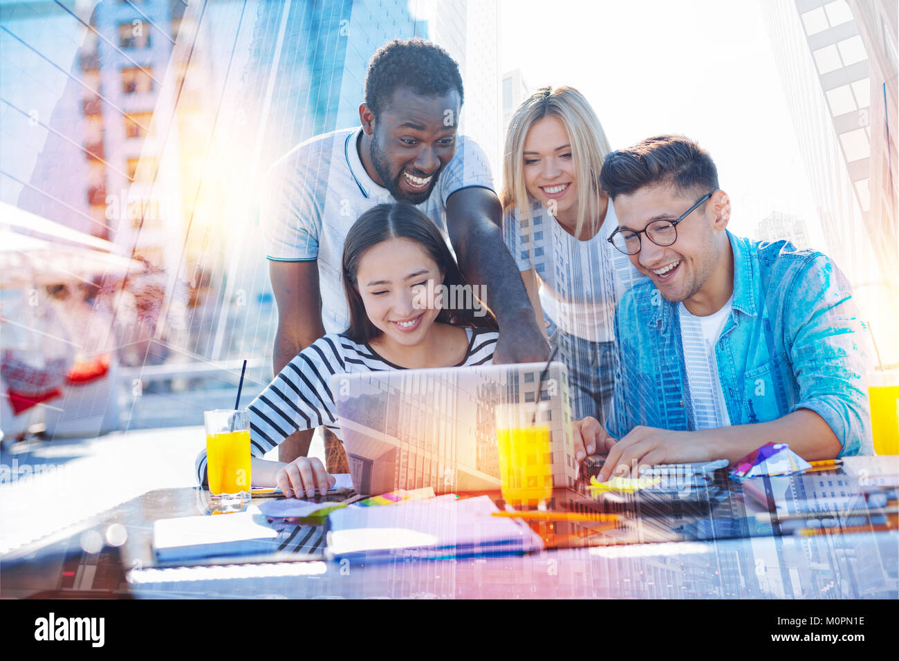 Positive friends having adorable time together Stock Photo - Alamy