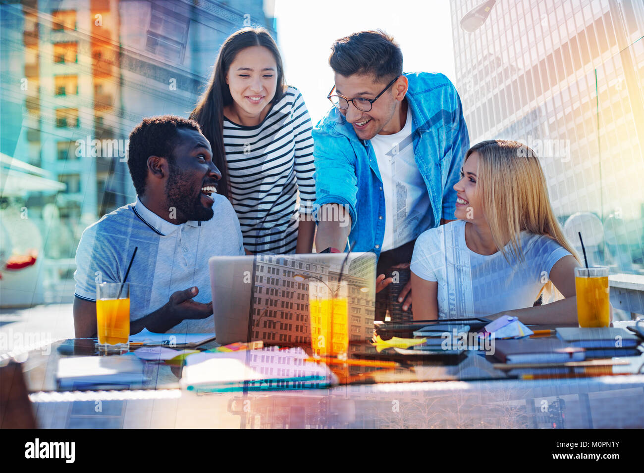 Excited students working on new project Stock Photo - Alamy