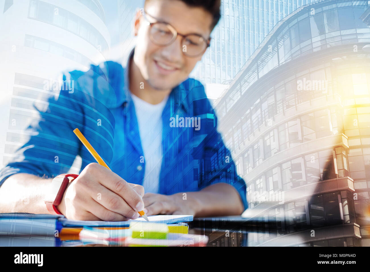 Inspired young man doing his job Stock Photo - Alamy