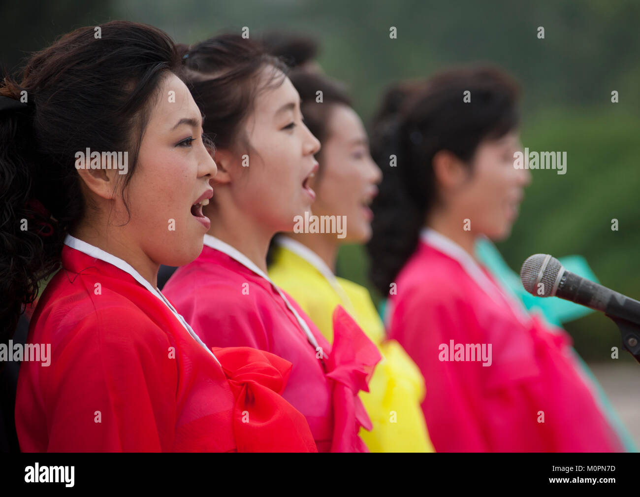 North Korean state artists singing on national day in the street ...