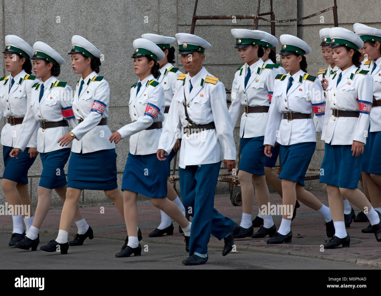 Group of North Korean traffic security officers in white uniforms in ...