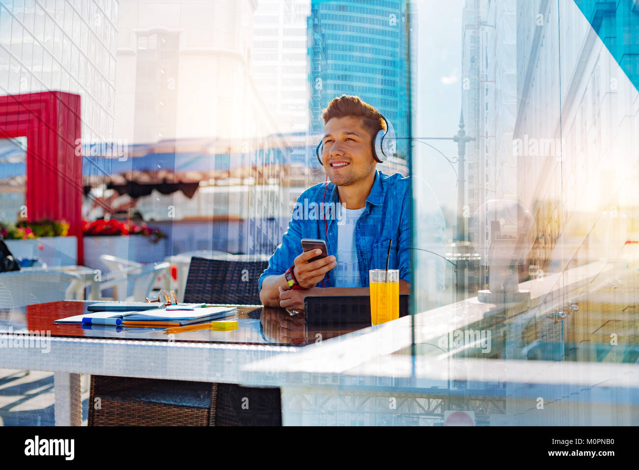 Inspired man relaxing and listening to music Stock Photo - Alamy