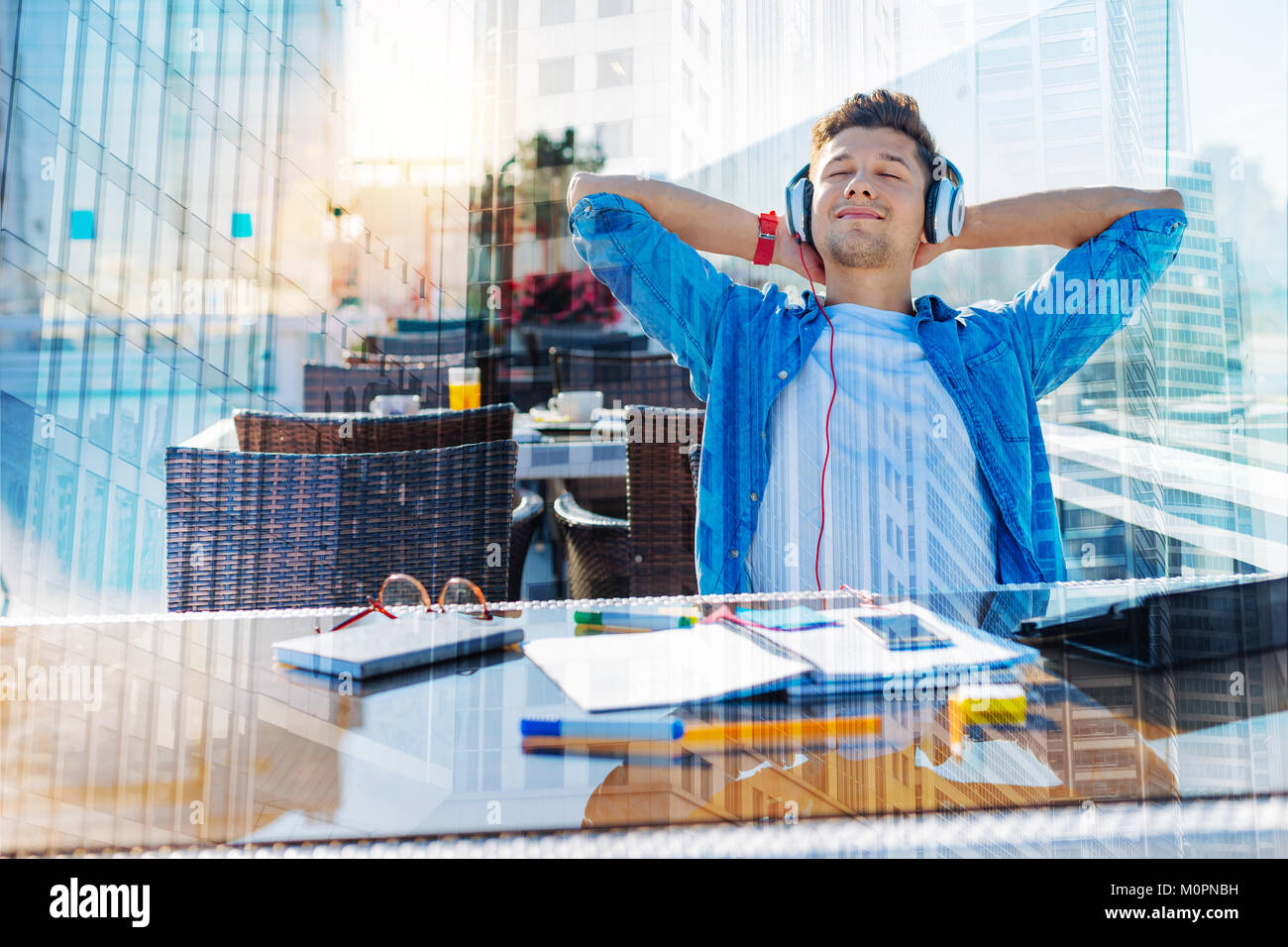 Inspired man listening to music Stock Photo - Alamy