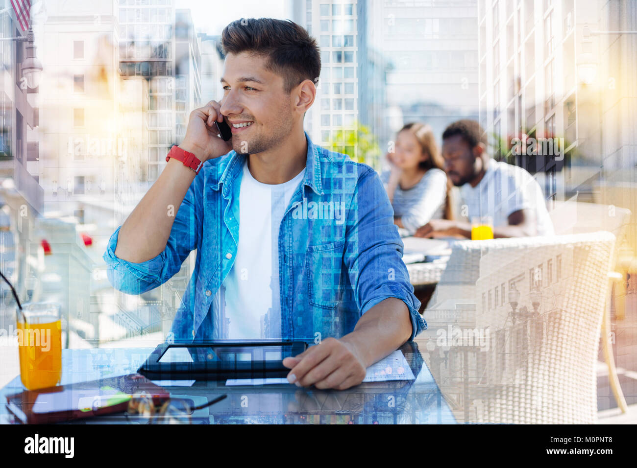 Joyful young man looking aside Stock Photo - Alamy