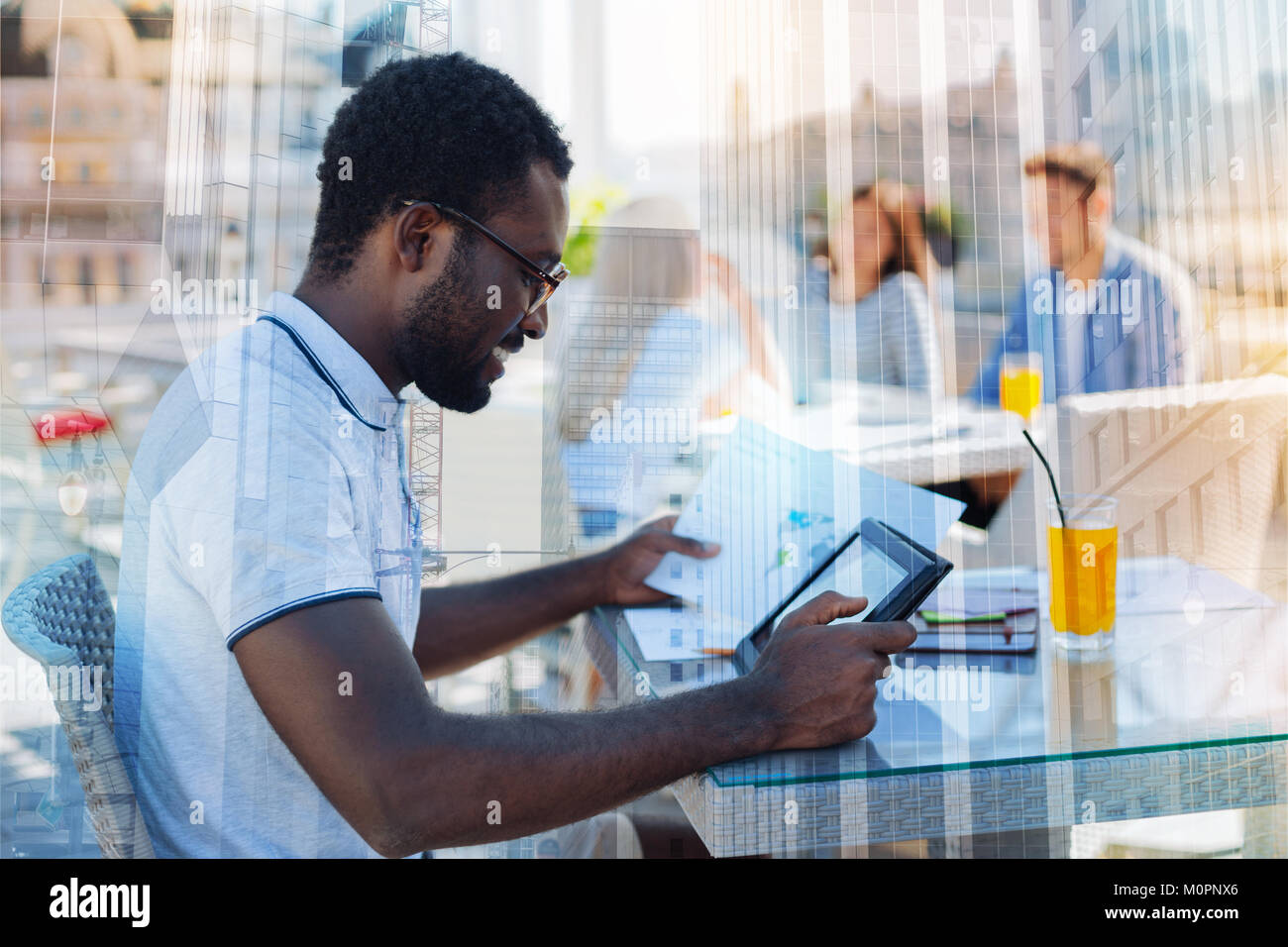 Profile photo of attentive male that doing task Stock Photo - Alamy