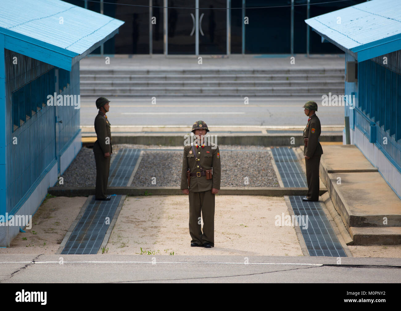 Three North Korean soldiers standing in front of the United Nations ...
