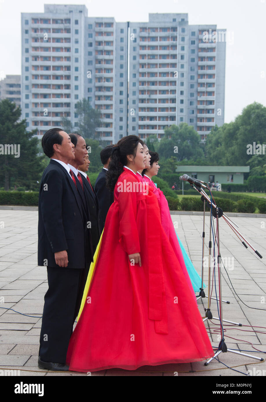 North Korean state artists singing on national day in the street ...