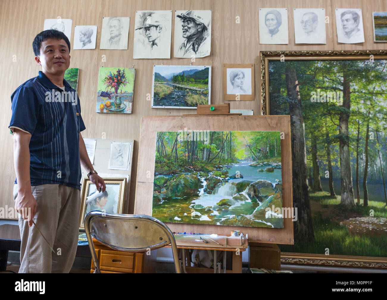 North Korean state artist in his workshop at Mansudae art studio ...