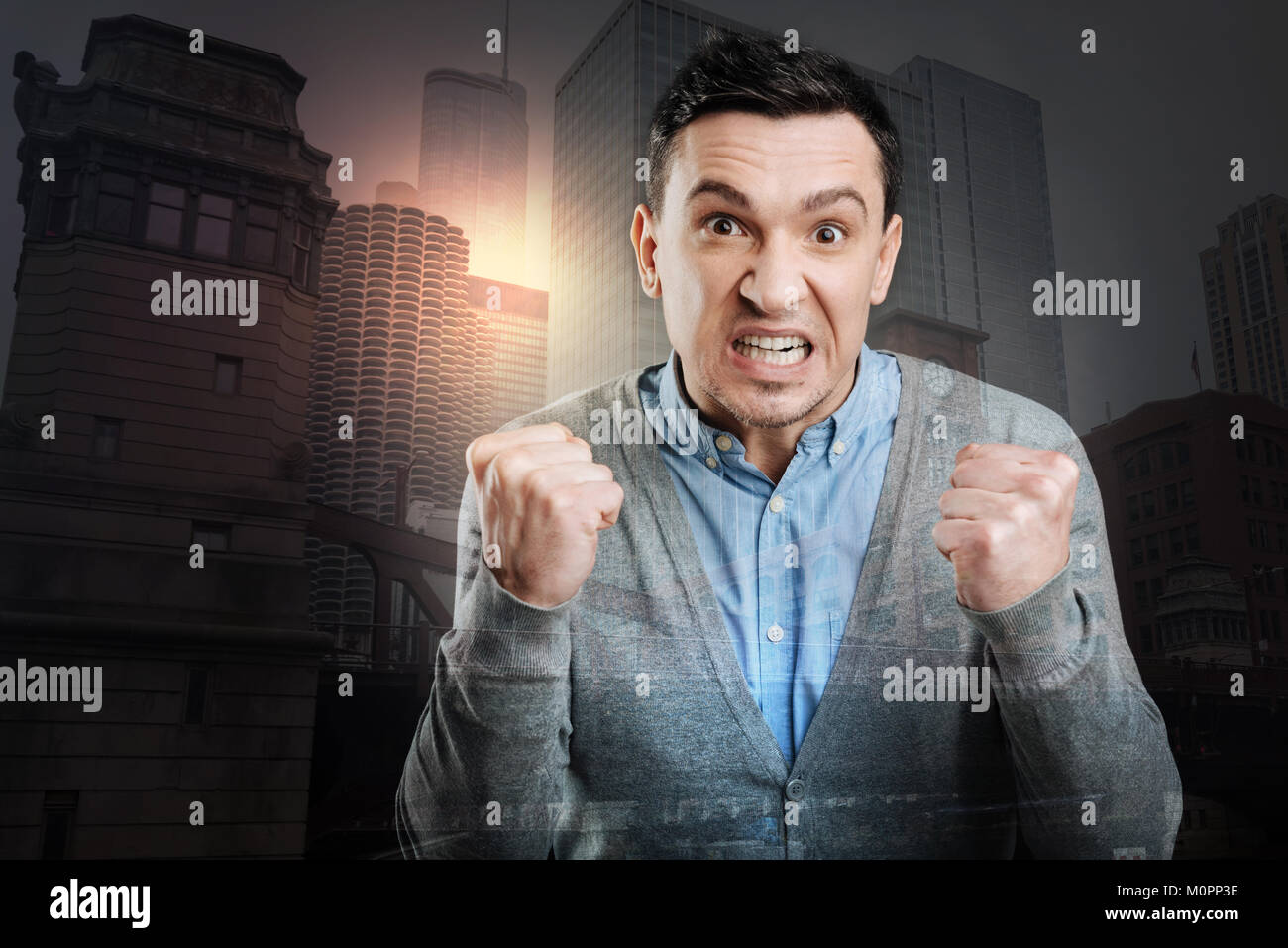 Extremely angry millennial guy losing his temper Stock Photo - Alamy