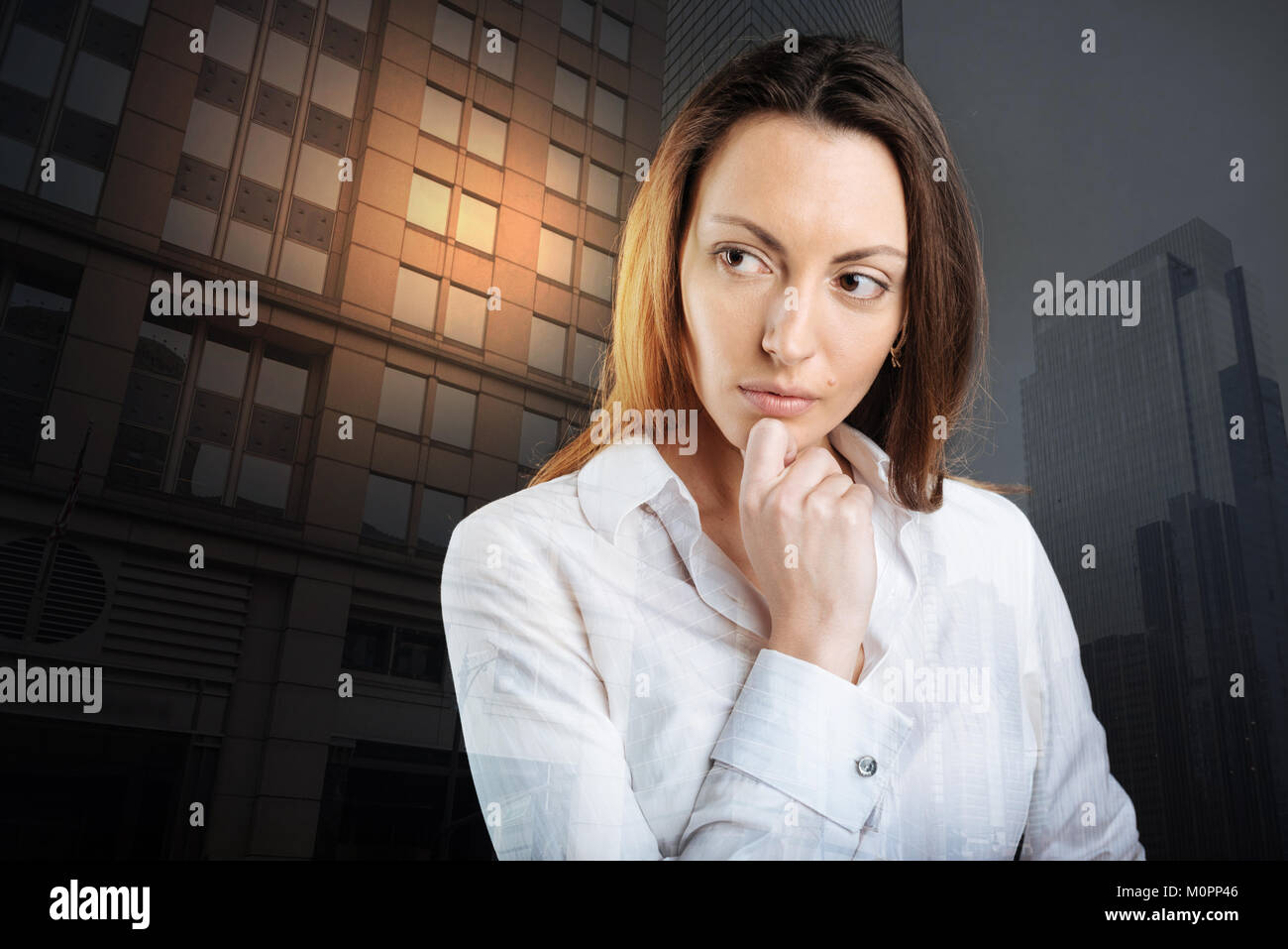 Pensive young woman thinking about something serious Stock Photo - Alamy