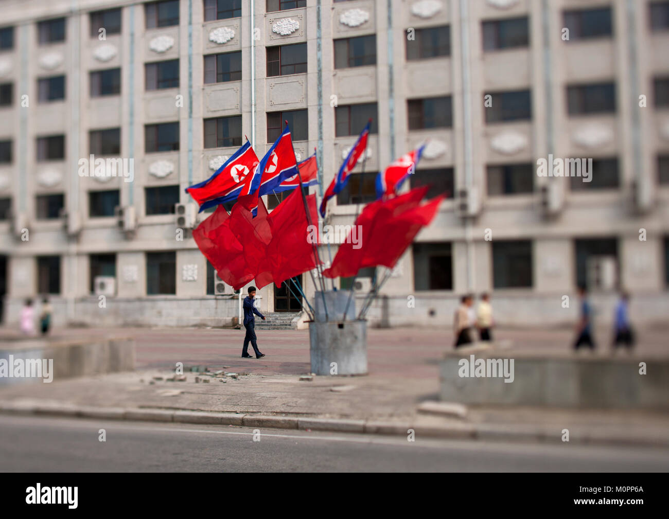 Set of North Korean flags in front of a building, Pyongan Province ...
