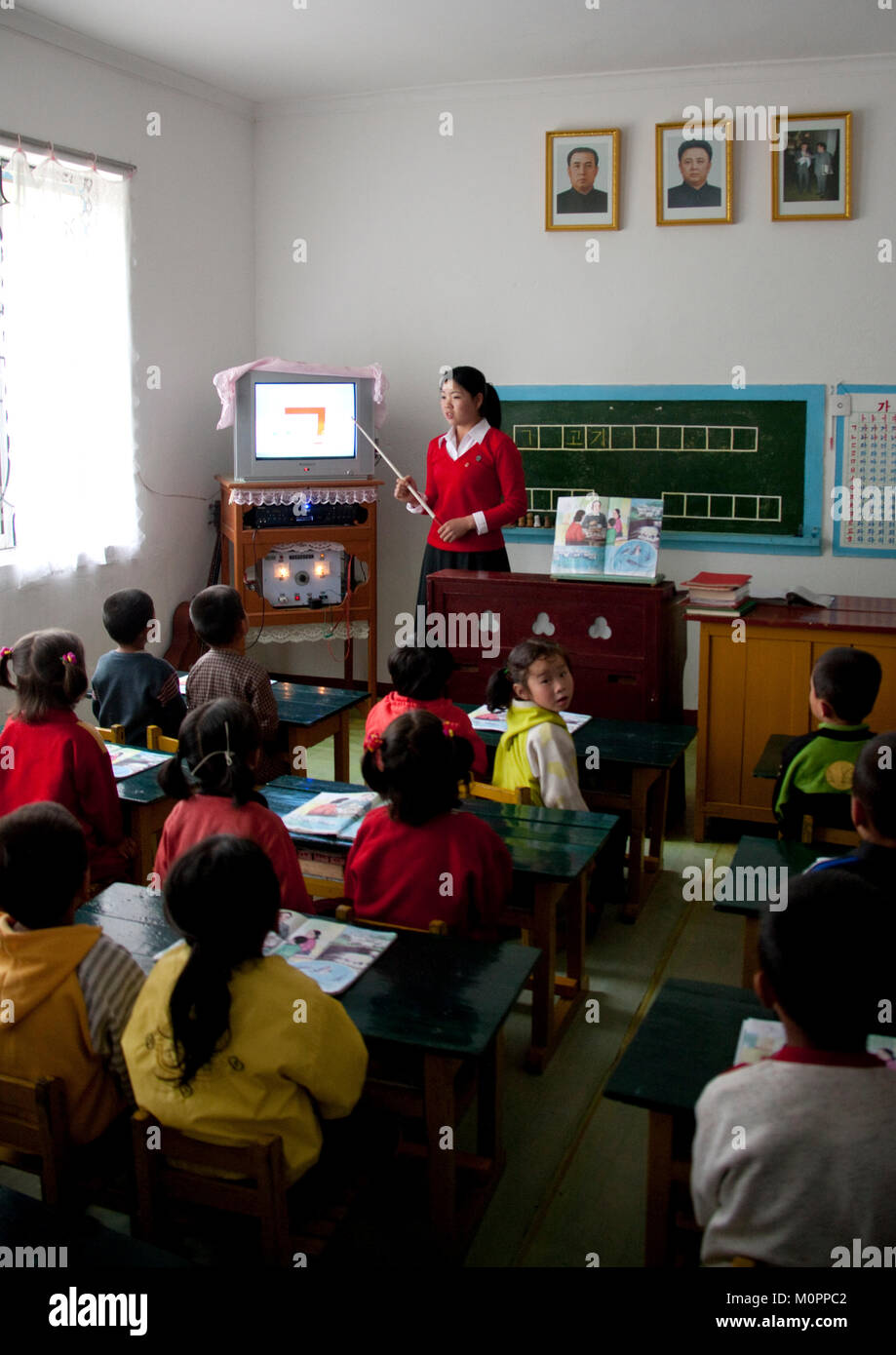 North Korean pupils with their teacher in a classroom, South Pyongan ...