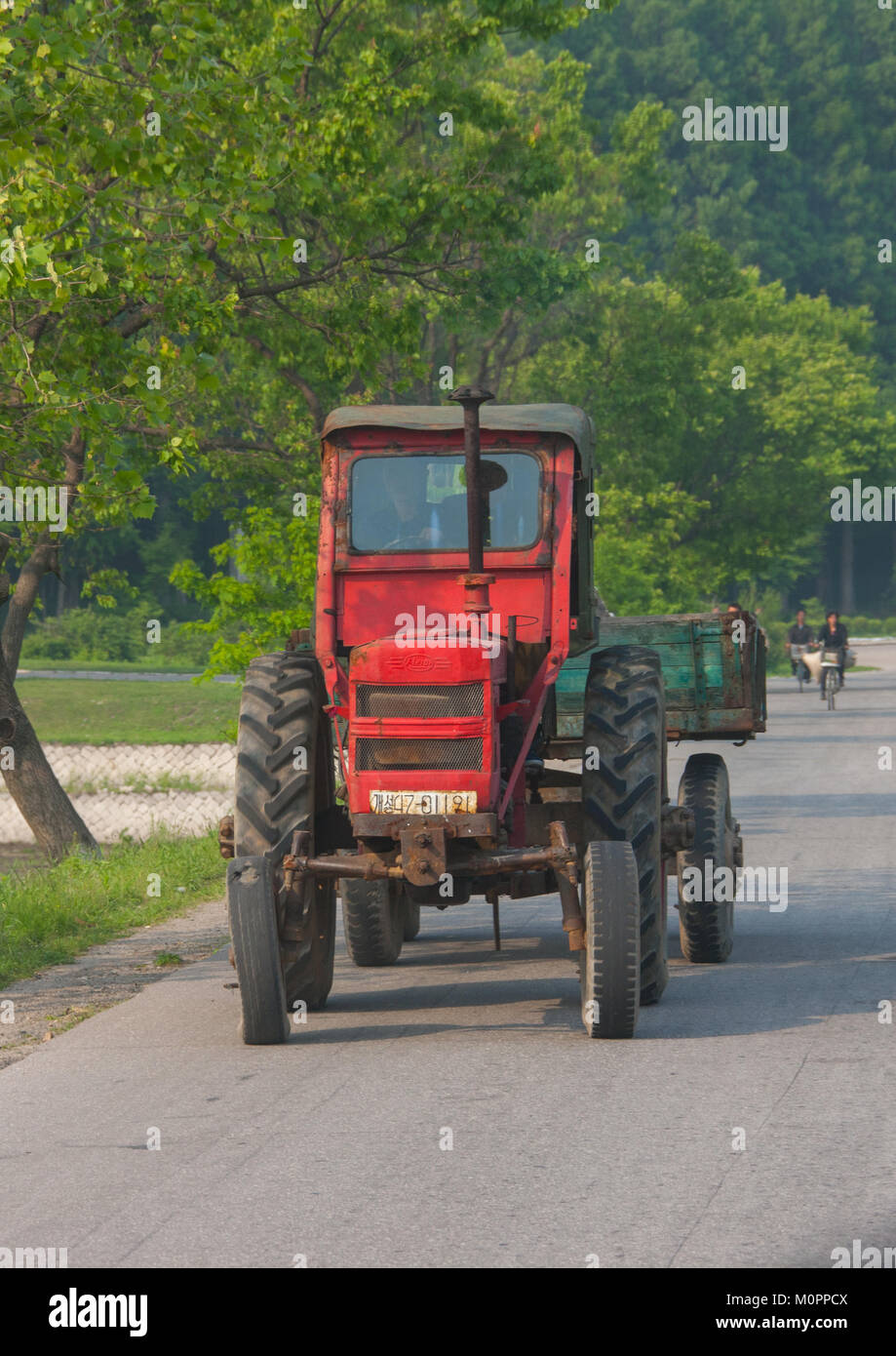 Old North Korean tractor on the road in the countryside, North Hwanghae ...