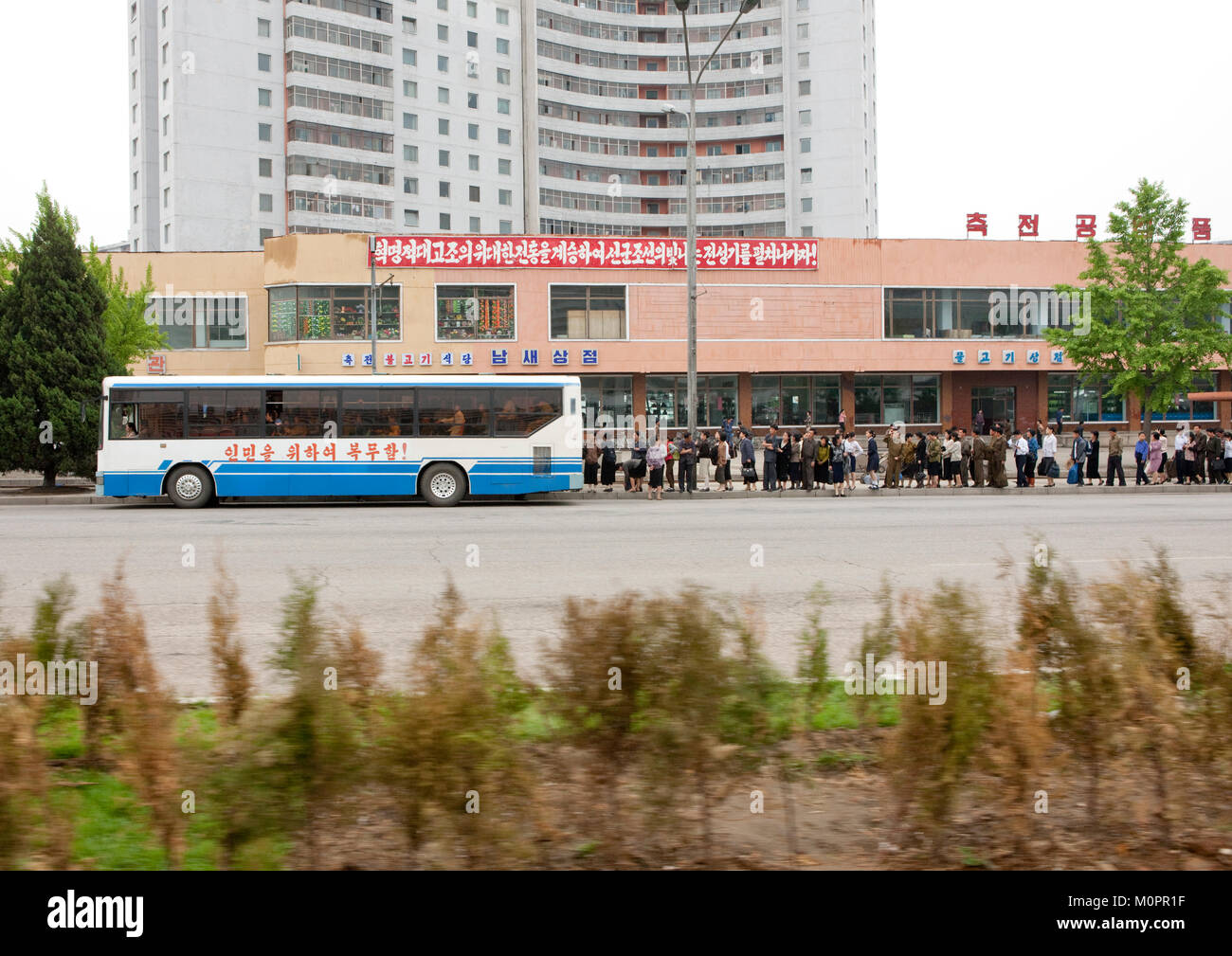 North Korean people queueing to take the bus, Pyongan Province ...