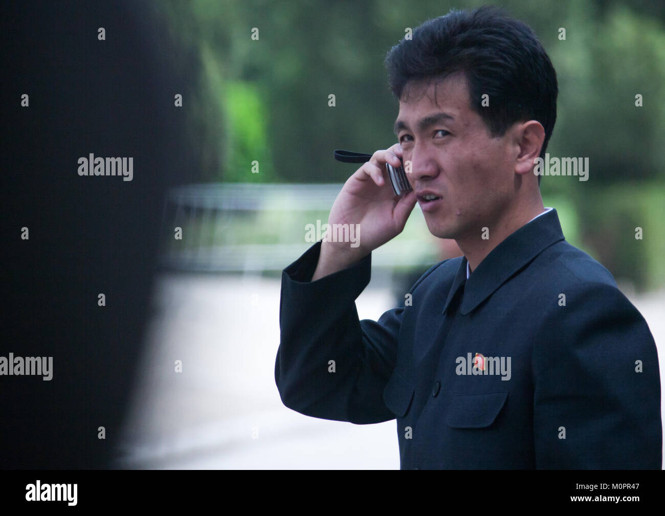 North Korean man calling with a mobile phone, Pyongan Province ...