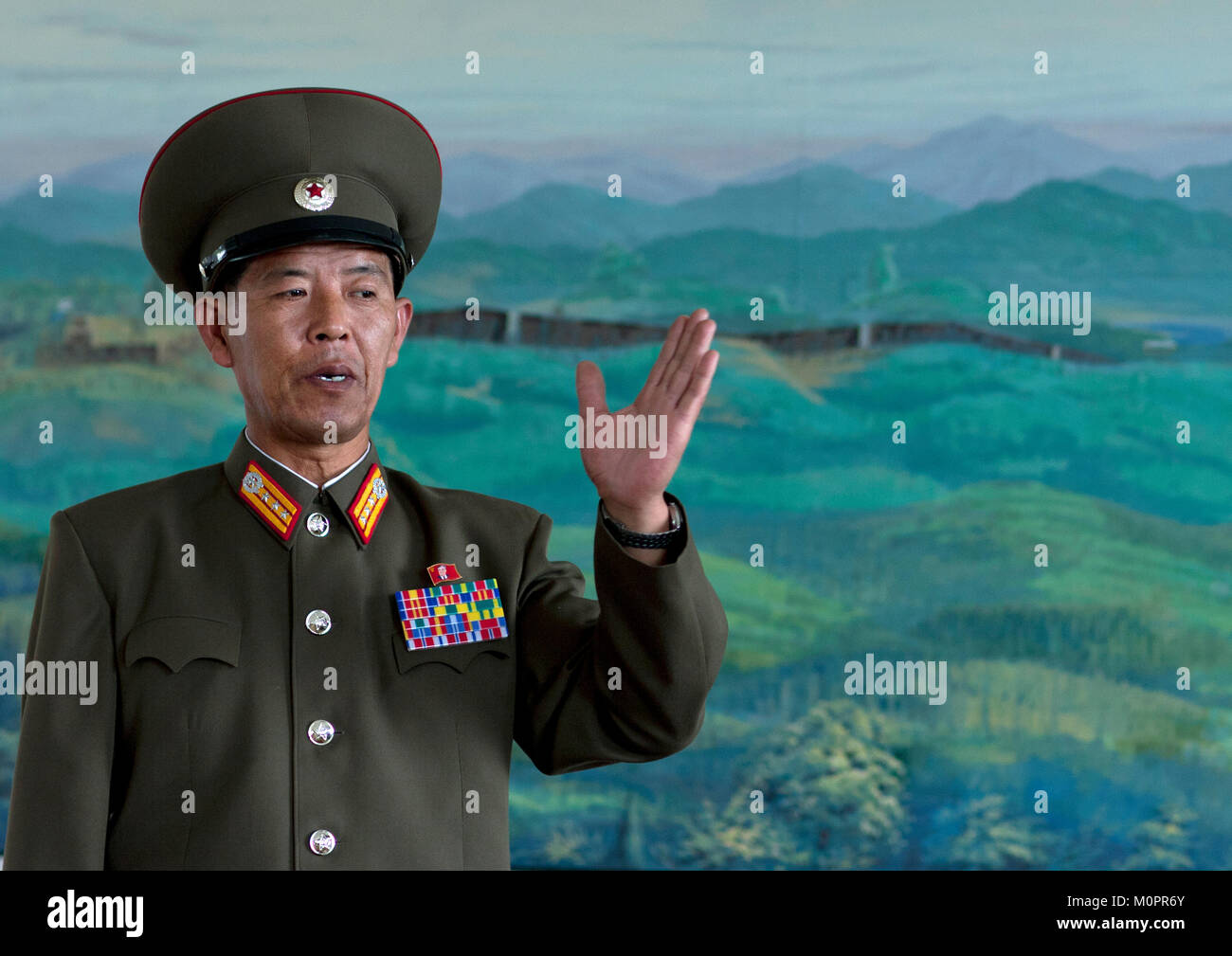 North Korean military officer in the section wall of the Demilitarized ...