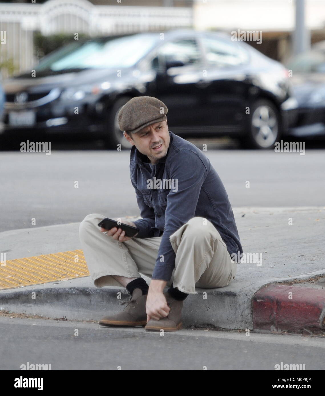 EXCLUSIVE Actor Giovanni Ribisi sitting on the curb while waiting for ...