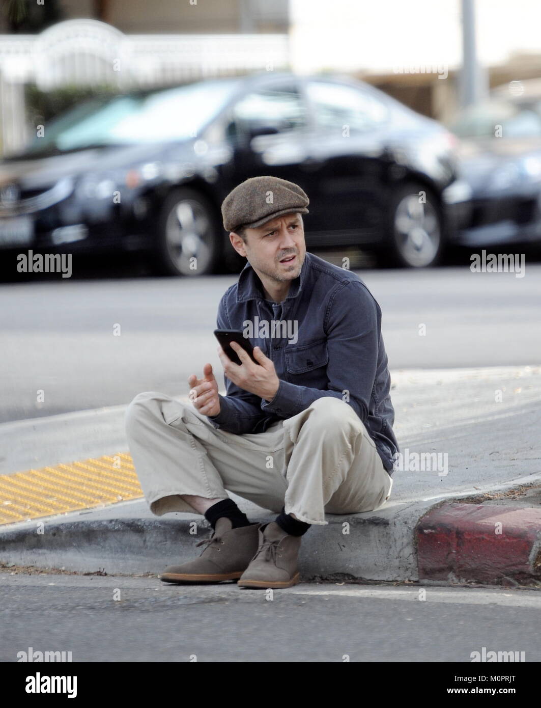 EXCLUSIVE Actor Giovanni Ribisi sitting on the curb while waiting for ...