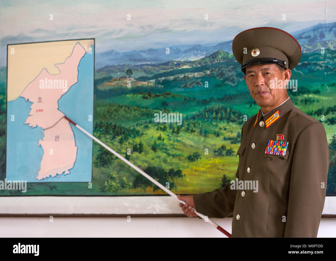 North Korean soldier in the joint security area in front of the map of ...
