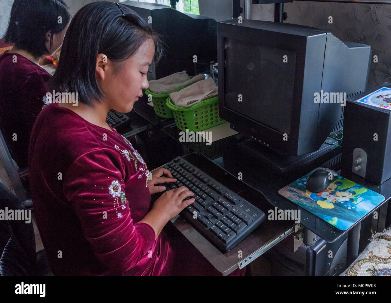Portrait of a North Korean girl using a computer without electricty ...