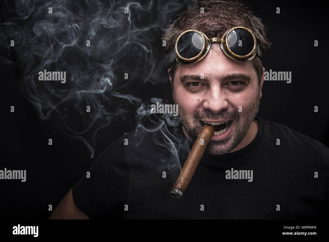 Steampunk smoker with a cuban cigar Stock Photo - Alamy