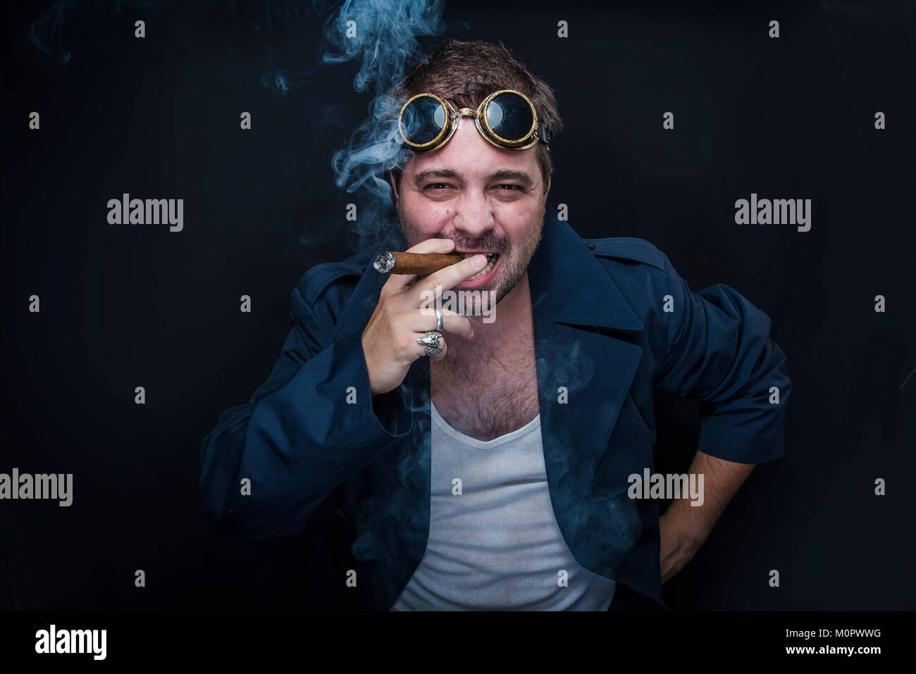 Steampunk smoker with a cuban cigar Stock Photo - Alamy