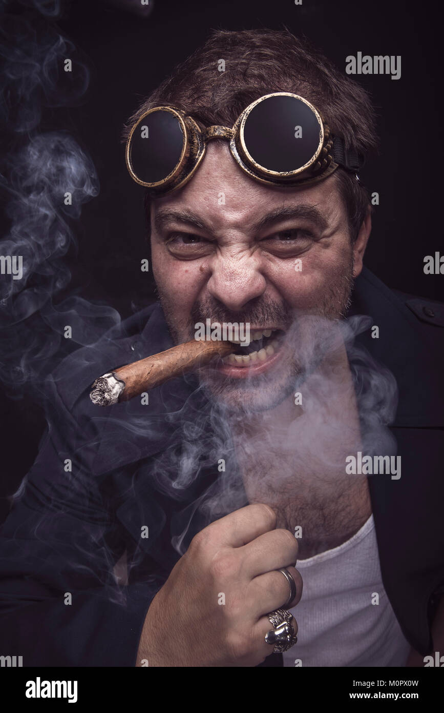 Steampunk smoker with a cuban cigar Stock Photo - Alamy