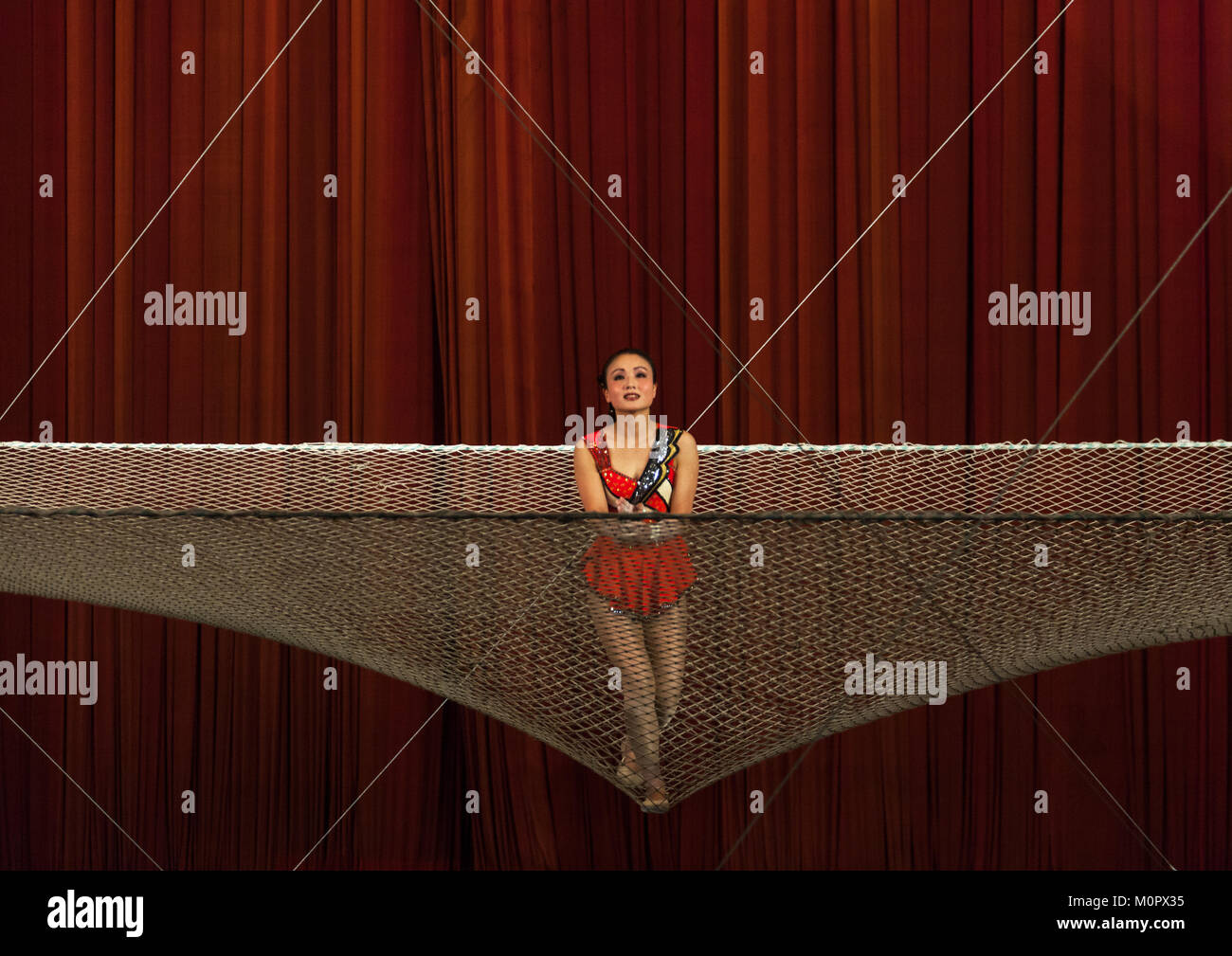 North Korean woman acrobat on a safety net in a circus, Pyongan ...