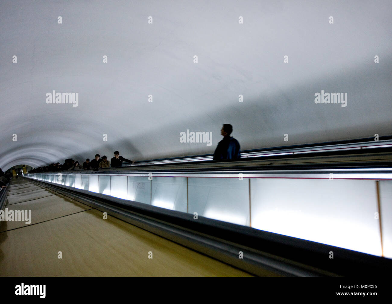 North Korean people using escalator leading to the subway station ...