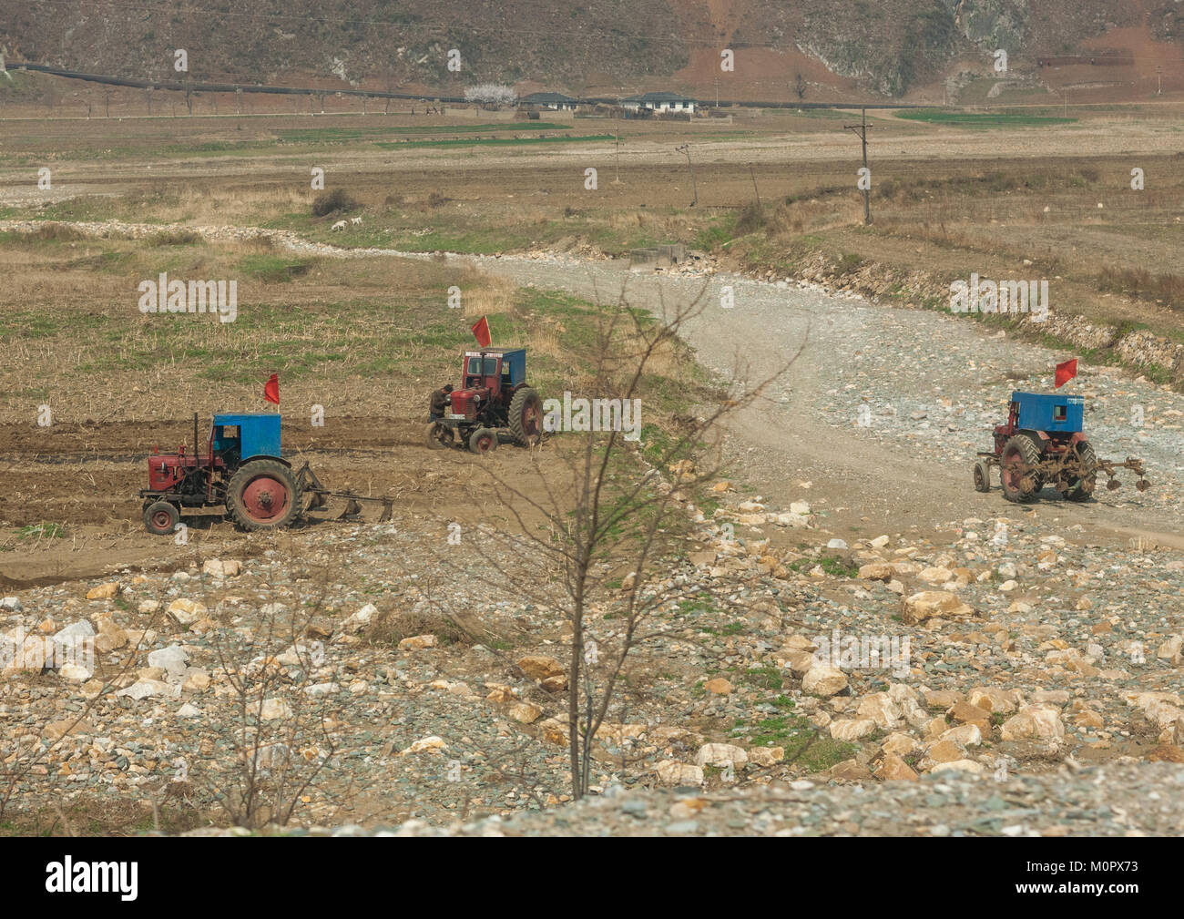 Old North Korean tractors in a field in the countryside, Kangwon ...