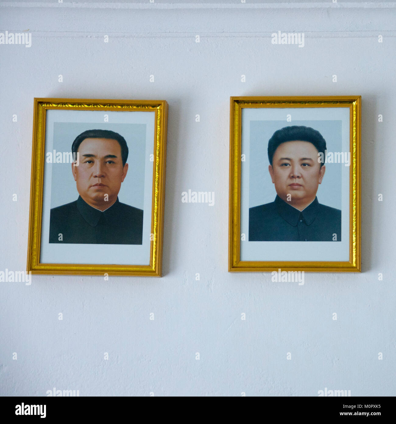 Official portraits of Kim il Sung and Kim Jong il in a home, South ...