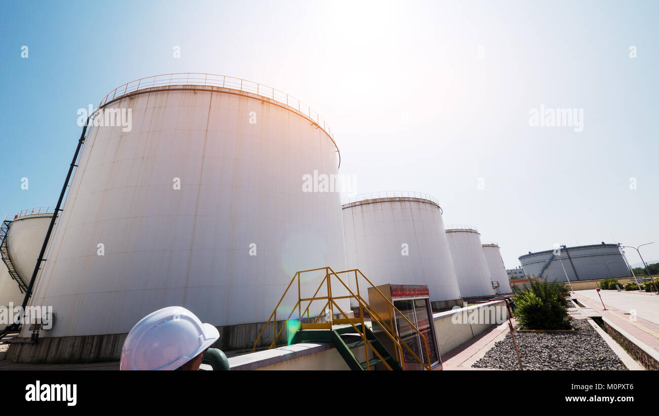 white steel tanks in petrochemical plant in blue sky Stock Photo - Alamy