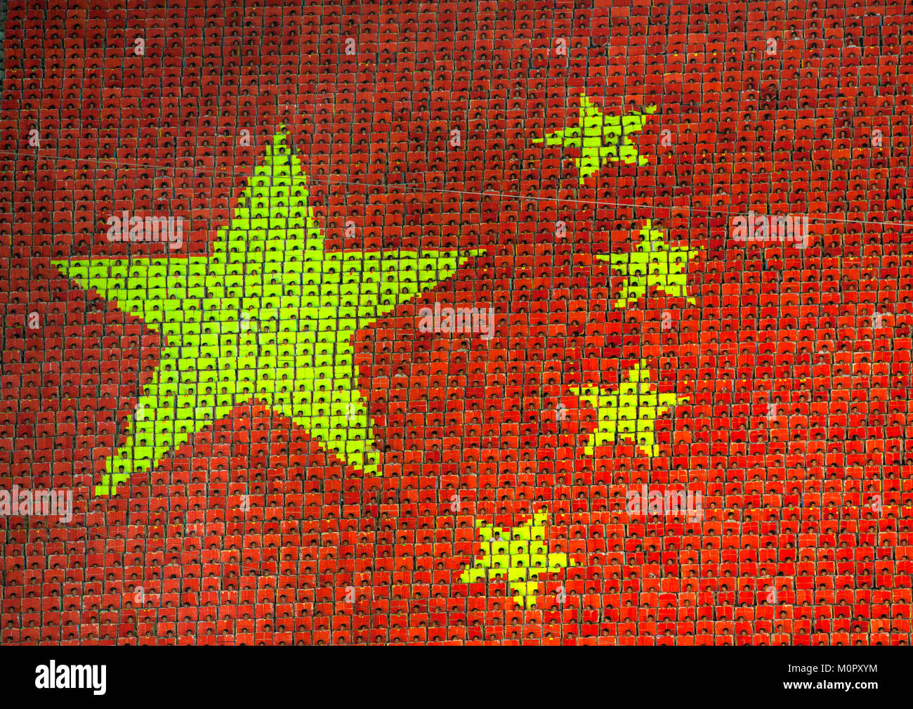 China flag made by children pixels holding up colored boards during ...