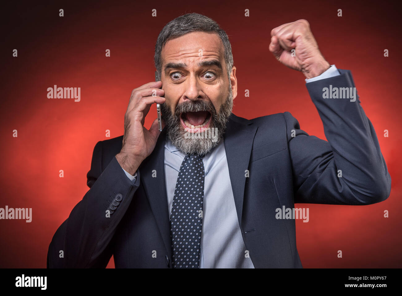 Amazing news for a senior business man Stock Photo - Alamy