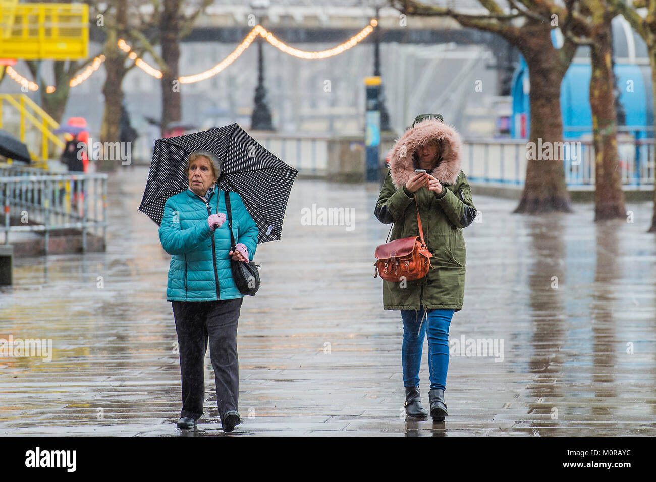 Southbank, London. 24th Jan, 2018. Wet wintry weather makes life ...