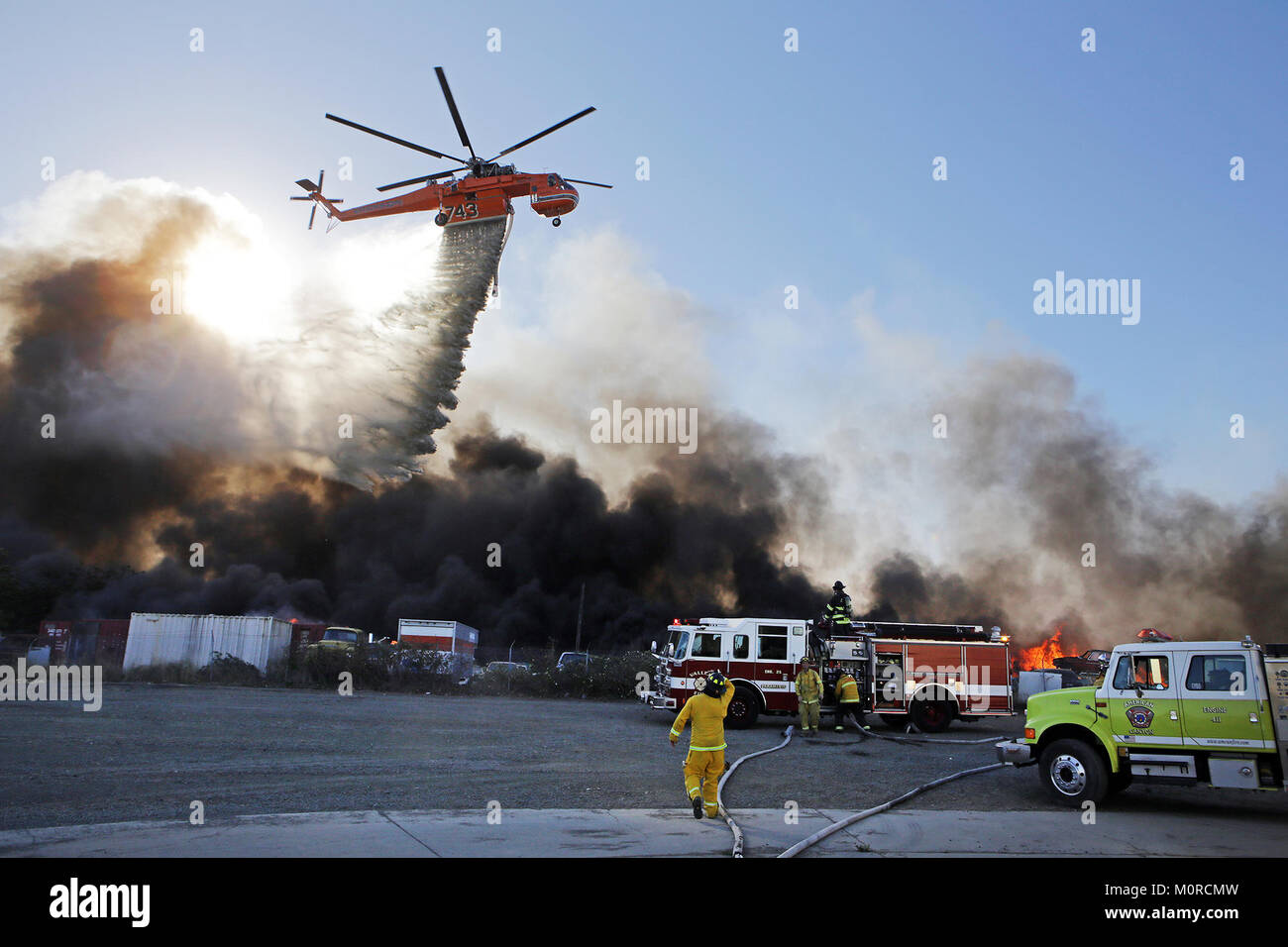 Napa, California, USA. 8th Oct, 2017. A helicopter makes a water drop ...