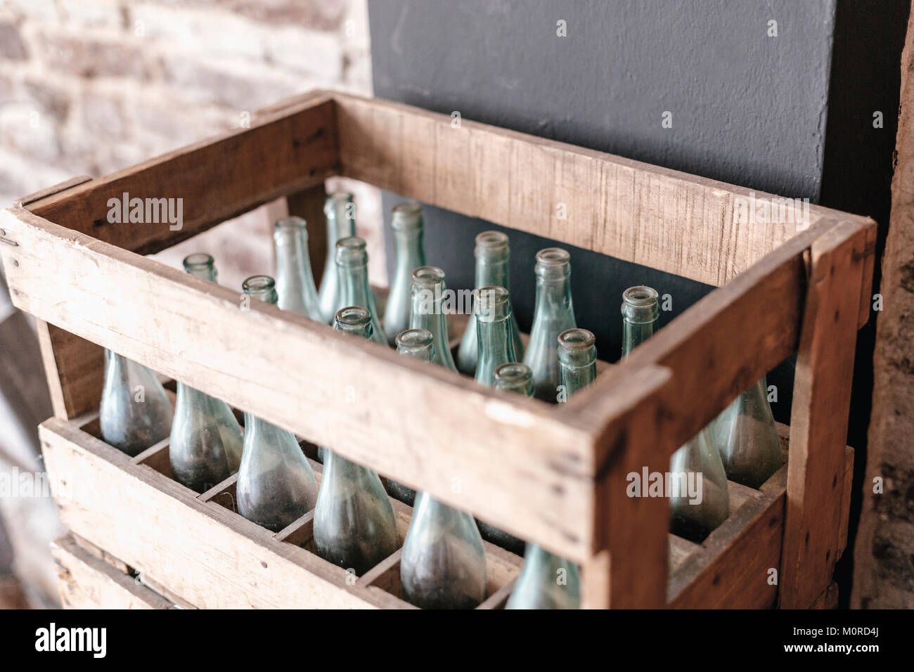 Empty bottles in a wooden crate Stock Photo - Alamy
