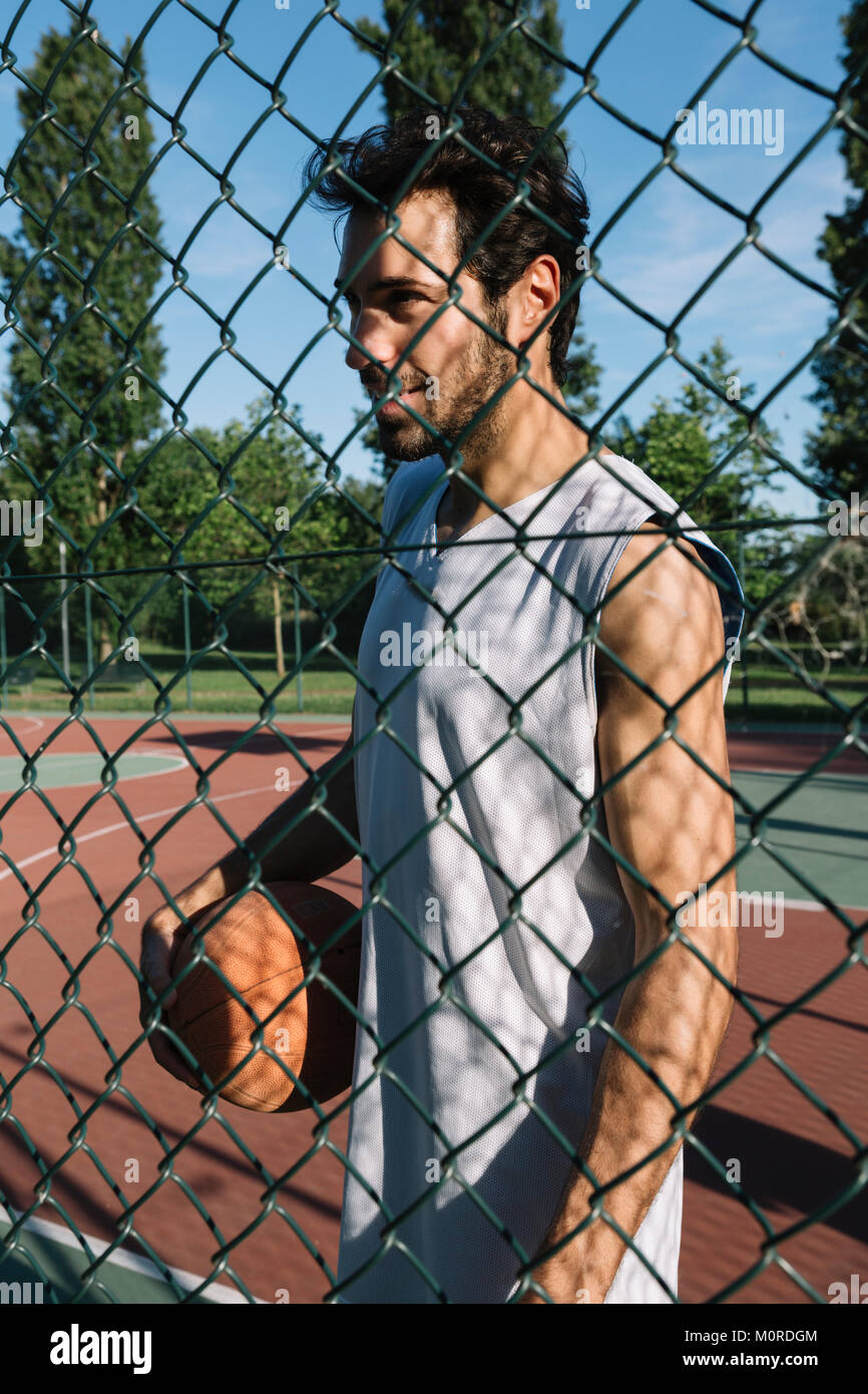 Man behind fence hi-res stock photography and images - Alamy