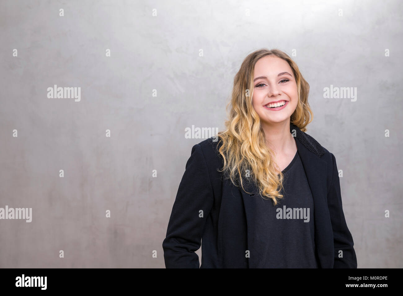 Portrait of laughing young woman Stock Photo - Alamy