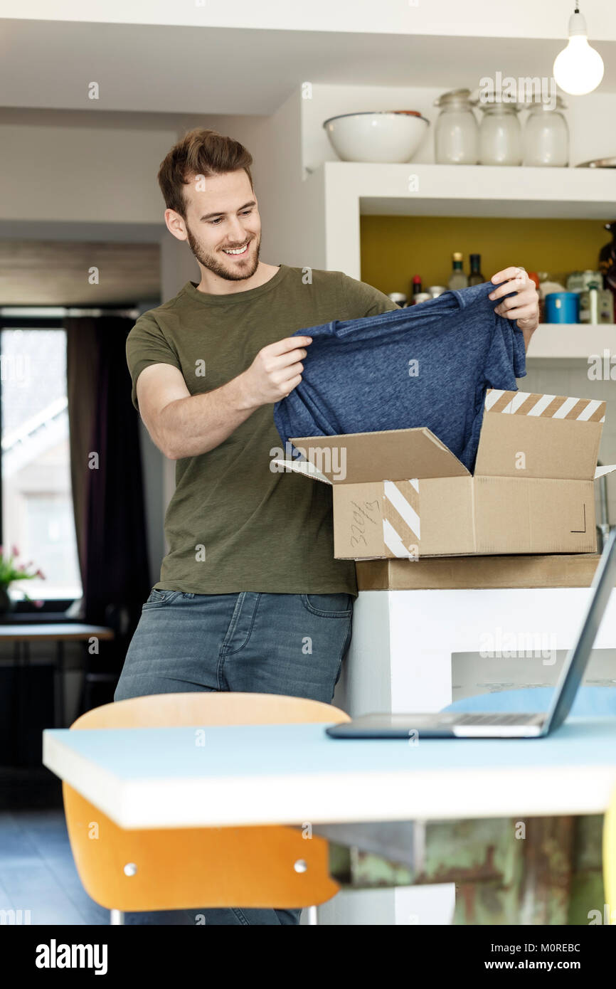 Unpacking parcel clothing hi-res stock photography and images - Alamy