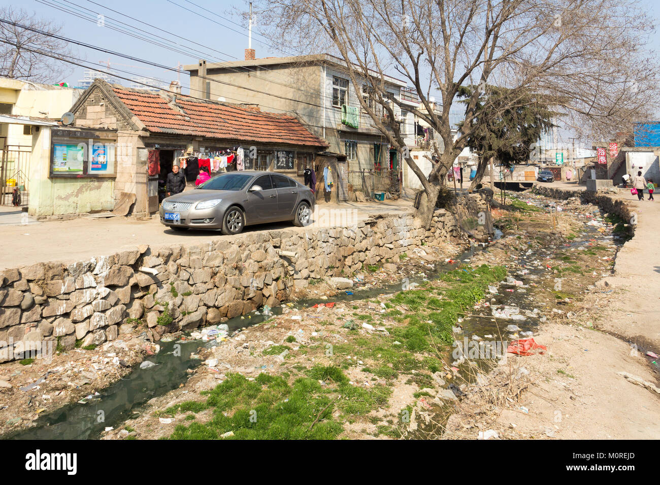 March 2014 - Qingdao, China - Daily life scene in the poor neighborhood ...