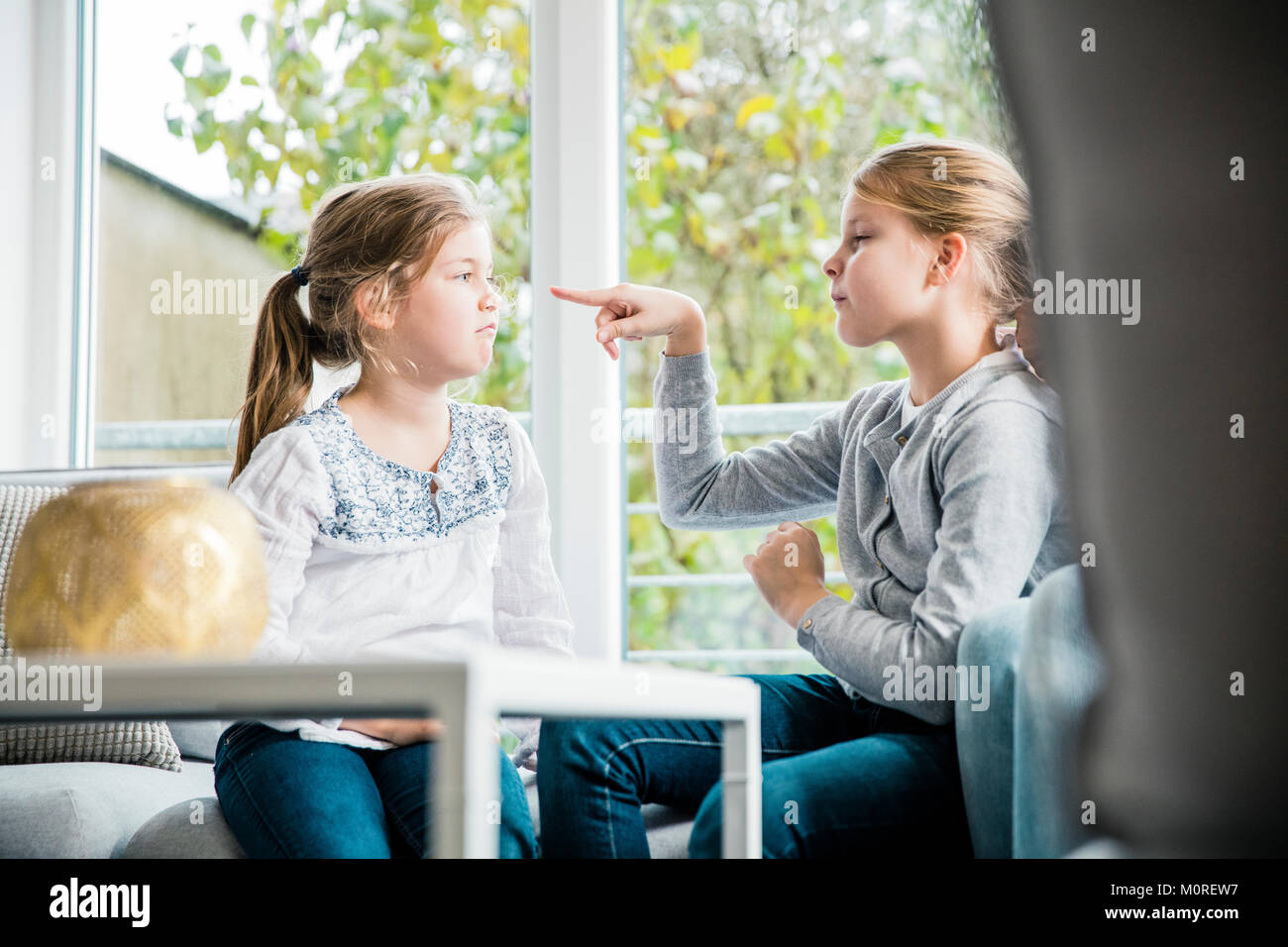 Two girls having a dispute Stock Photo - Alamy