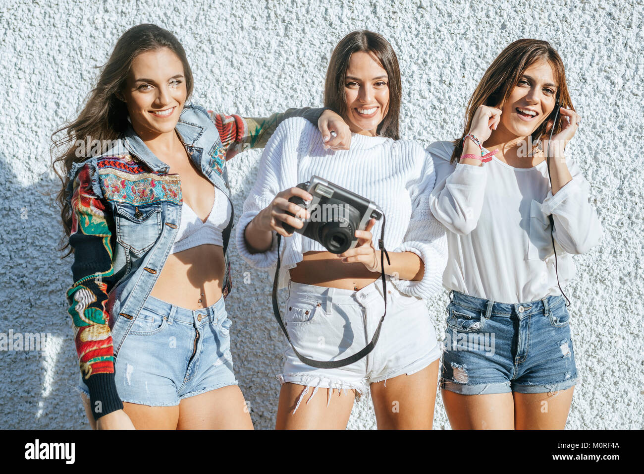 Group picture of three friends having fun together Stock Photo - Alamy