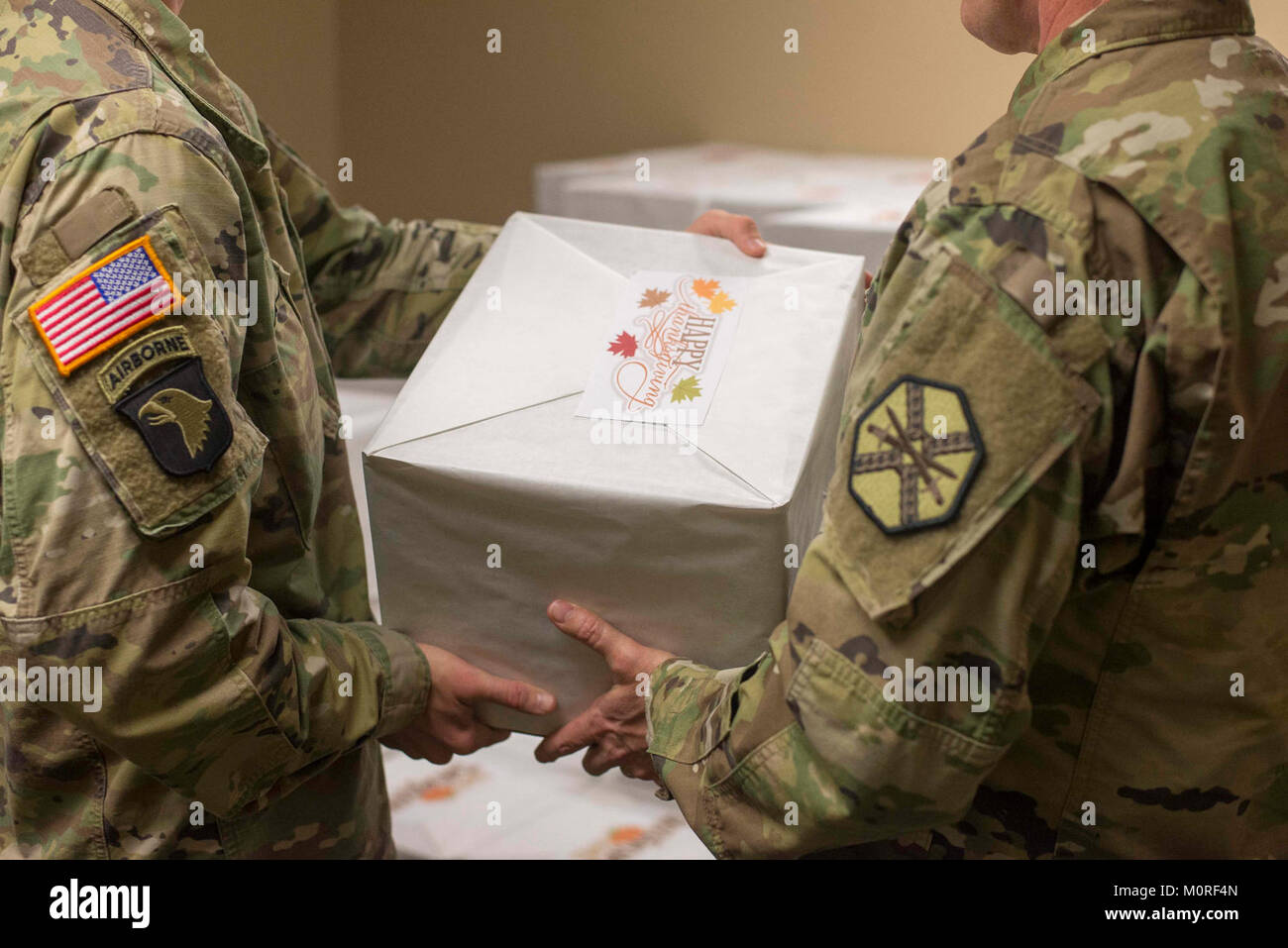 A 101st Airborne Division (Air Assault) Soldier receives a gift box ...