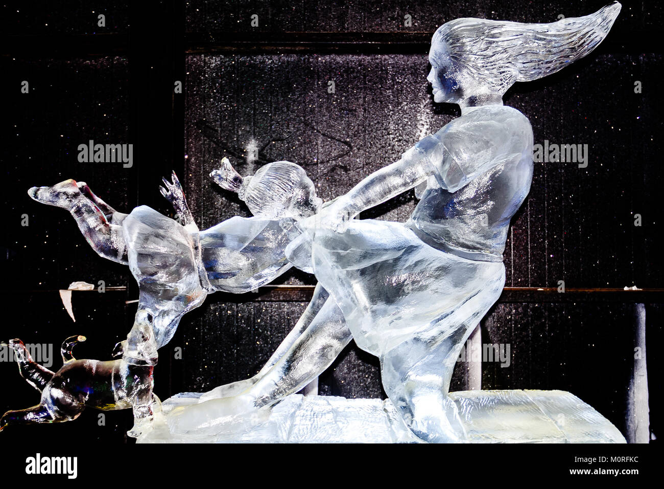 February 2013 - Haerbin, China - woman dancing with child ice statue at ...