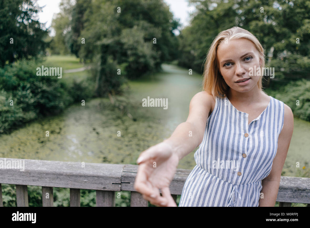 Hand reaching for railing hi-res stock photography and images - Alamy