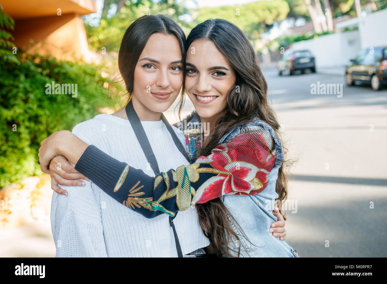 Portrait of two best friends head to head Stock Photo - Alamy