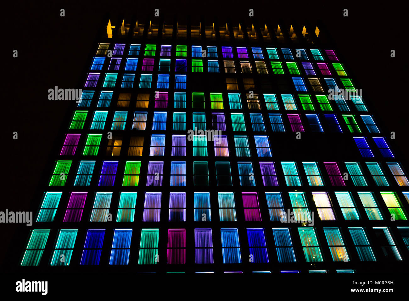 Colored windows texture. Windows illuminated by neon lights background ...