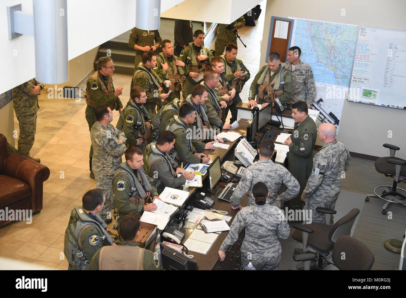 194th Fighter Squadron pilots from the 144th Fighter Wing recieve a ...