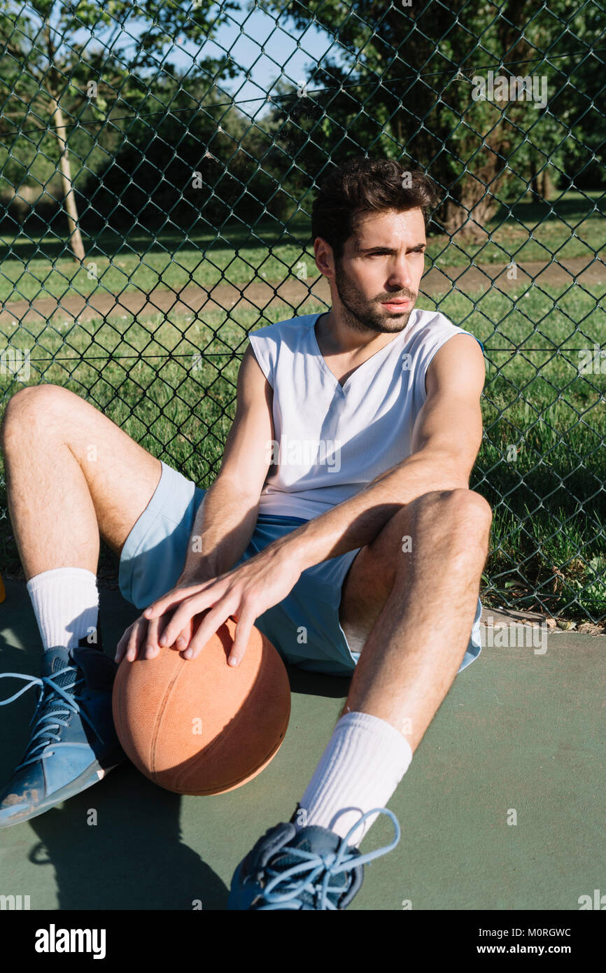Athlete basketball leaning on sports hi-res stock photography and ...